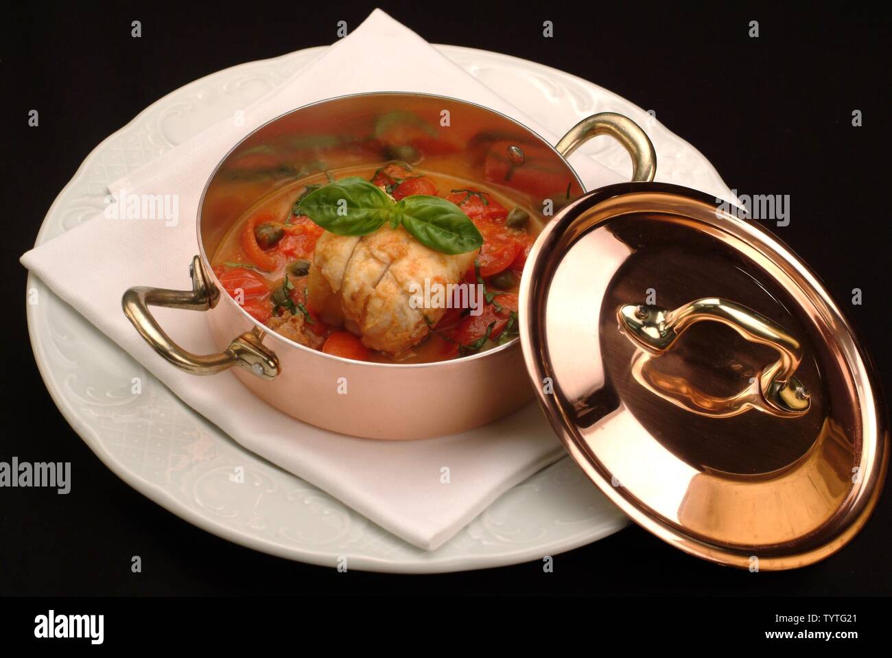 Italian food recipe, stewed monkfish Stock Photo - Alamy