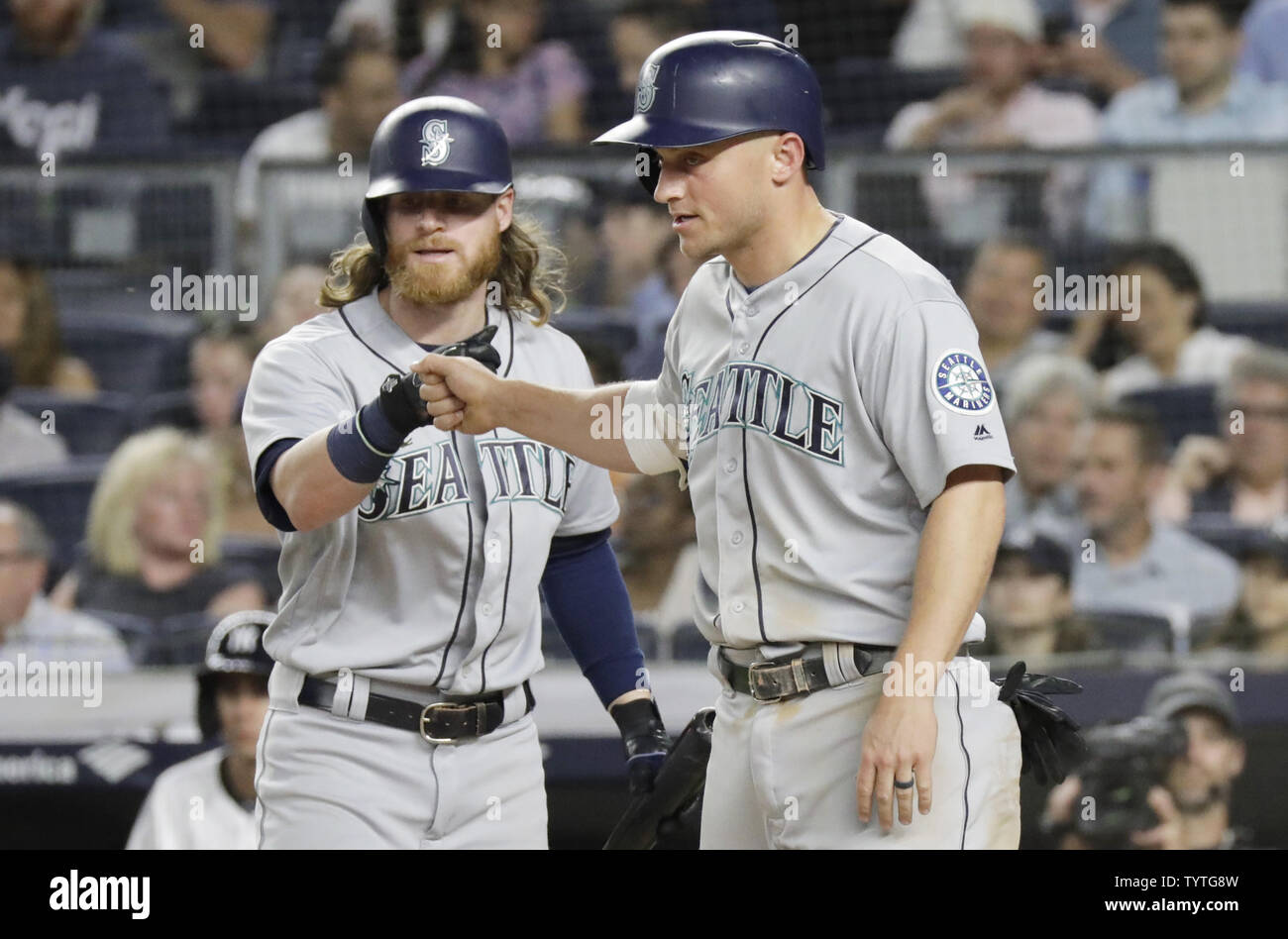 Seattle Mariners Kyle Seager celebrates at home plate with Ben Gamel ...