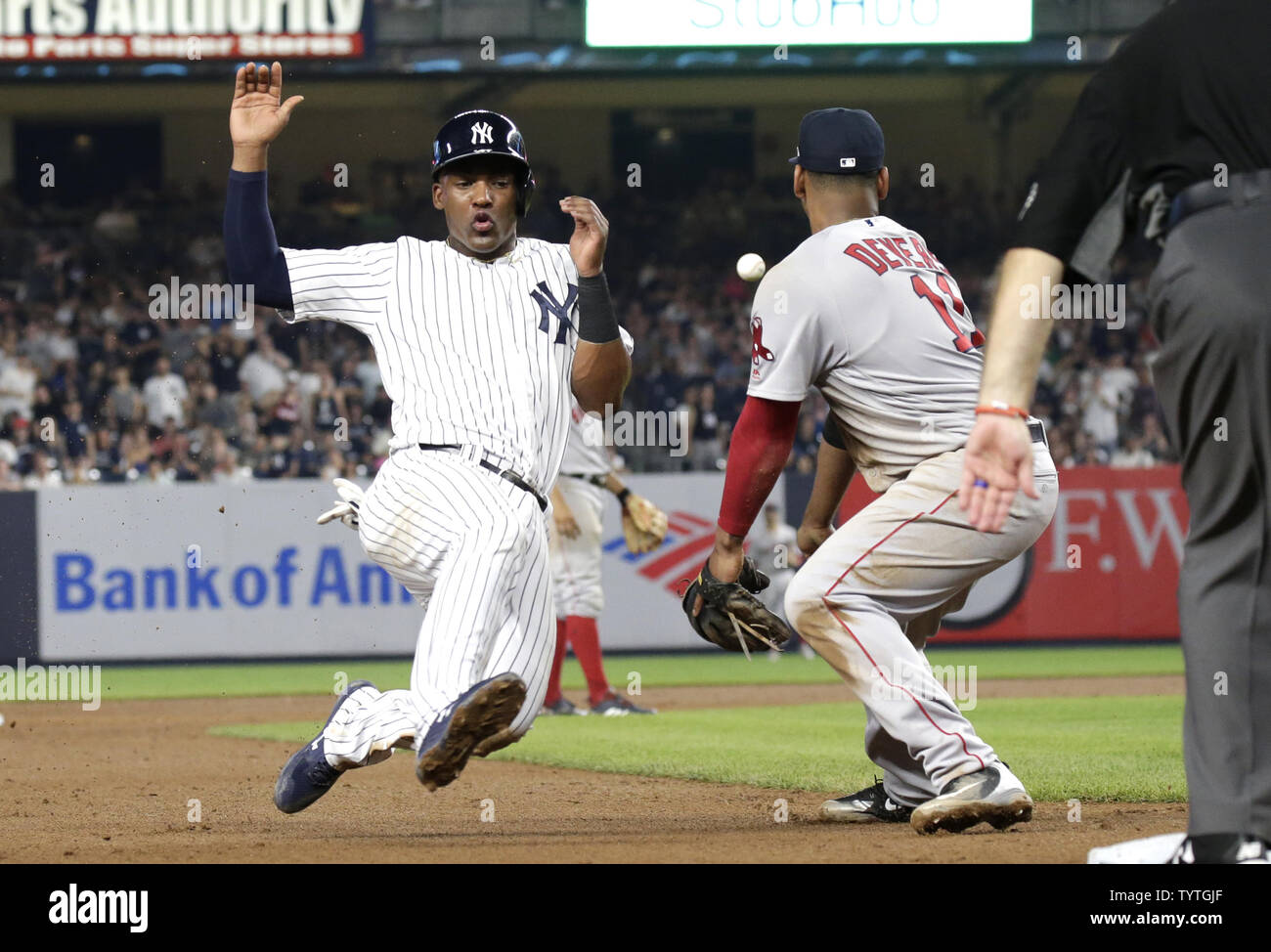 New York Yankees Miguel Andœjar slides safely into 3rd base in the 5th ...