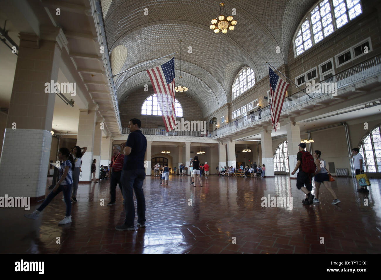 Tourists visit the Ellis Island National Museum of Immigration 2 days ...