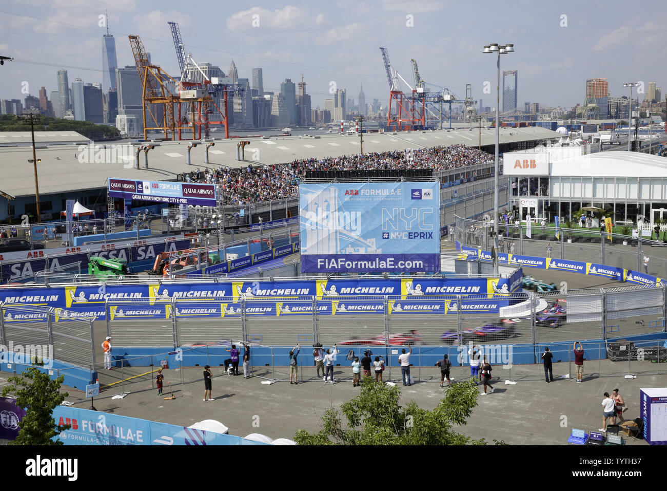 Cars race around the track at the New York City ePrix, Round 11 of the ...