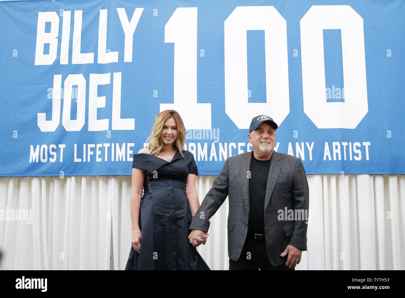 Billy Joel stands with wife Alexis Joel in front of his 100 Shows ...