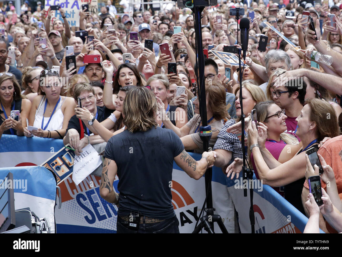 Keith Urban signs autographs when he performs on the NBC Today Show at ...