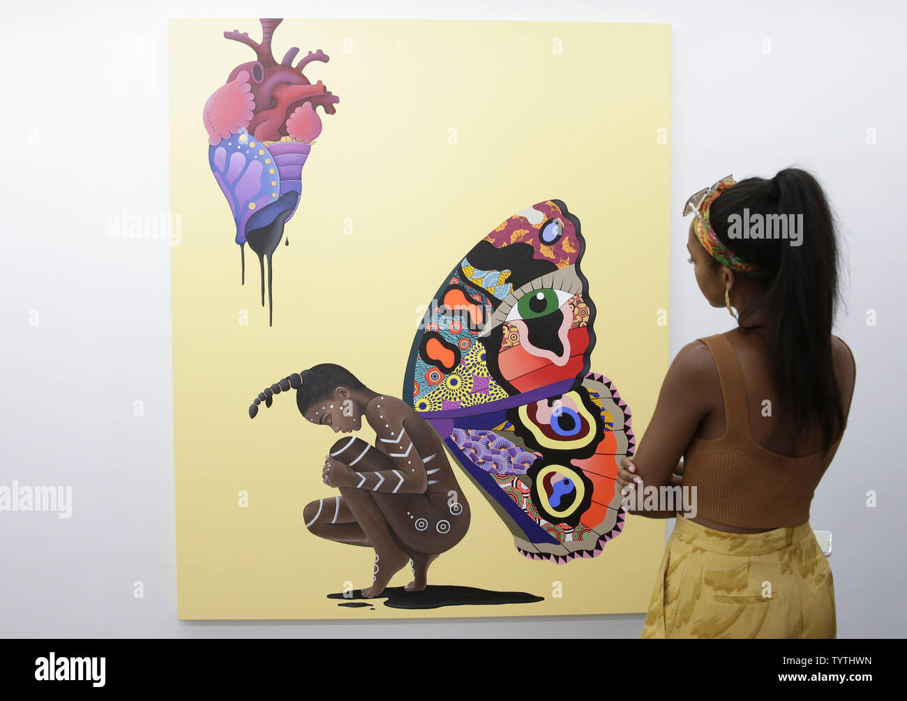 A painting titled "Metamorphosis" is on display at the "You Deserve A ...
