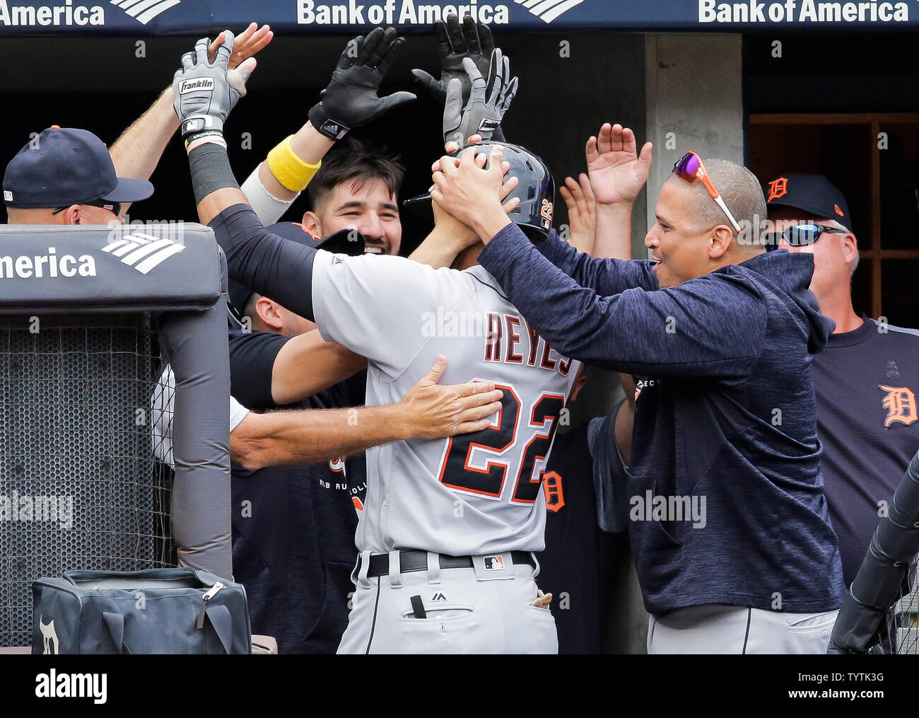 Detroit Tigers batter Victor Reyes is welcomed at the dugout steps ...