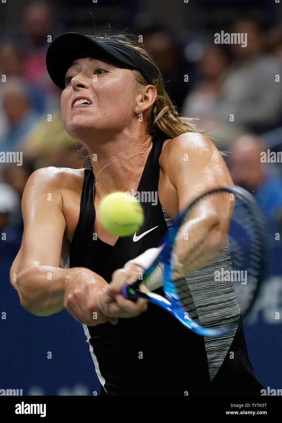 Maria Sharapova of Russia returns a shot from Carla Suarez Navarro of ...
