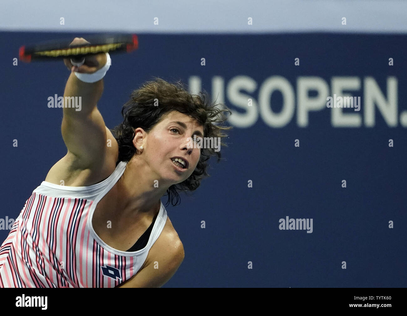 Carla Suarez Navarro of Spain serves to Maria Sharapova of Russia in ...