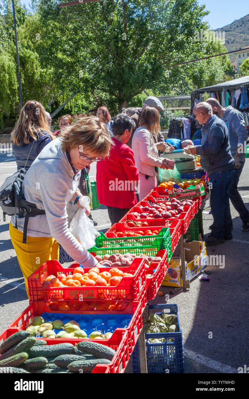 Women shopping and buying fresh fruit and vegetables produce at a ...