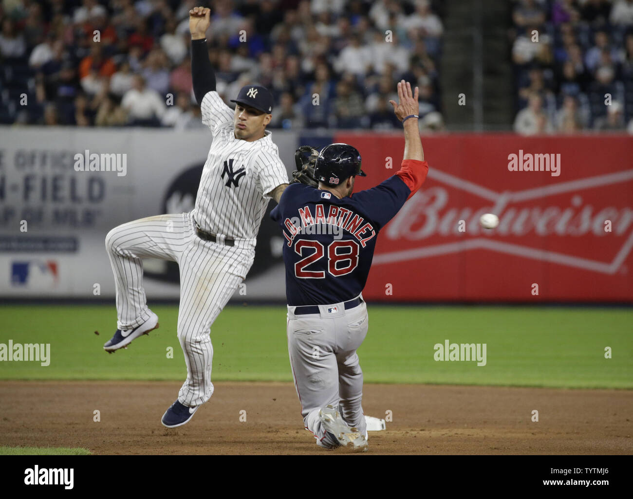 New York Yankees Gleyber Torres can't field a ball allowing Boston Red Sox J. D. Martinez to ...