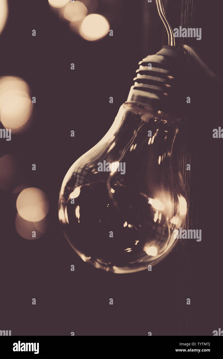 Image of glowing light bulb on dark background, moody tones Stock Photo ...