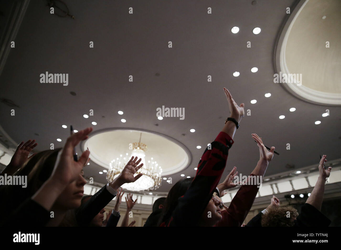 Media raise their hands to ask a question when United States President ...