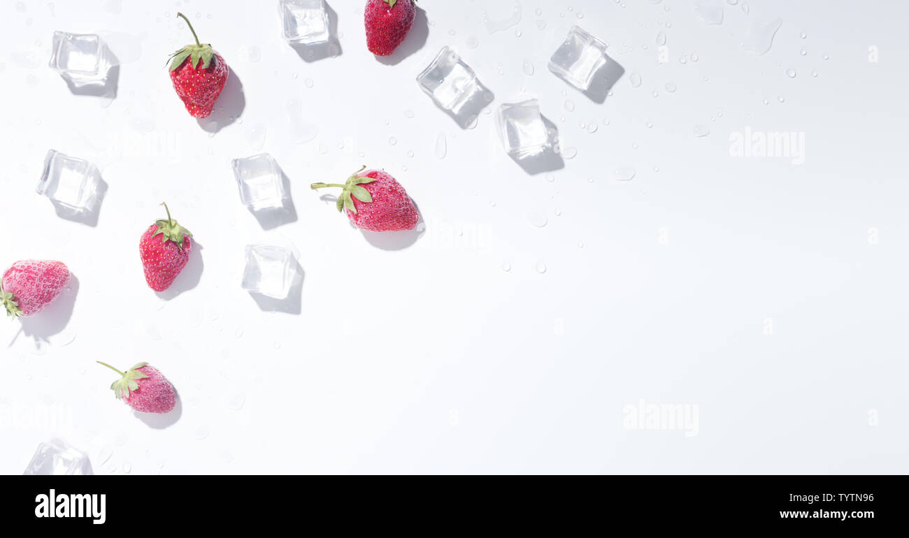 Fresh strawberry with ice cubes on white background Stock Photo - Alamy