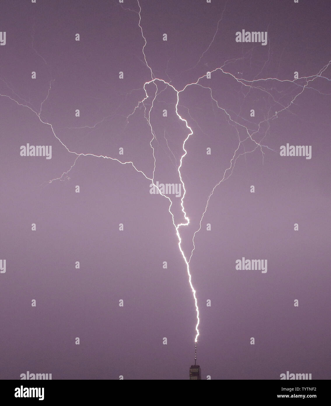 Lightning strikes the spire of One World Trade Center in lower ...
