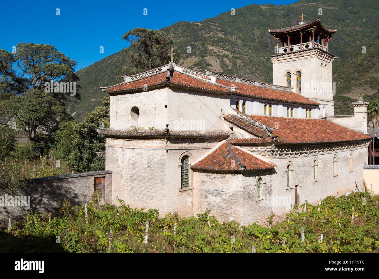 In front of the 100-year-old Izhong Church in Deqin County, Diqing ...