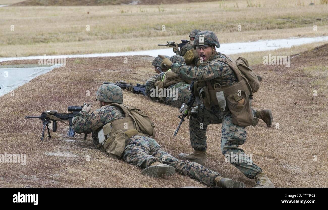 A Marine with 1st Battalion, 8th Marine Regiment gives a command to ...
