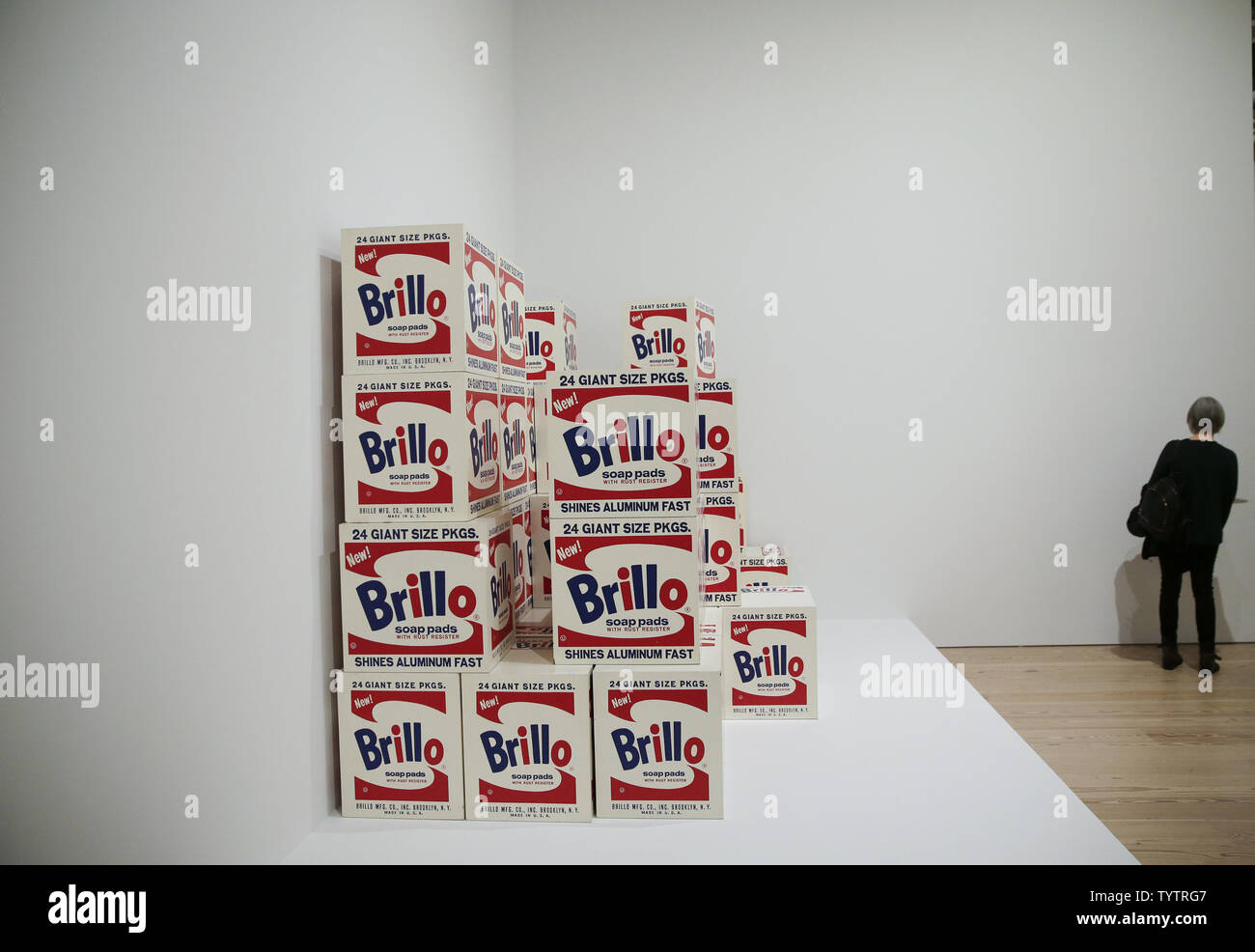 People stand among works of art by Andy Warhol at a member preview for the upcoming exhibit ...