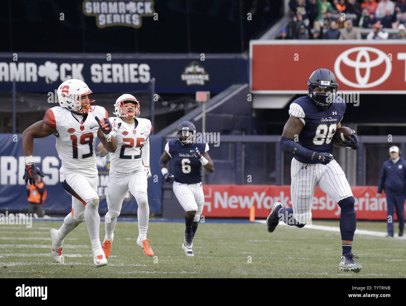 Notre Dame Alize Mack runs down the sidelines with the ball in the ...