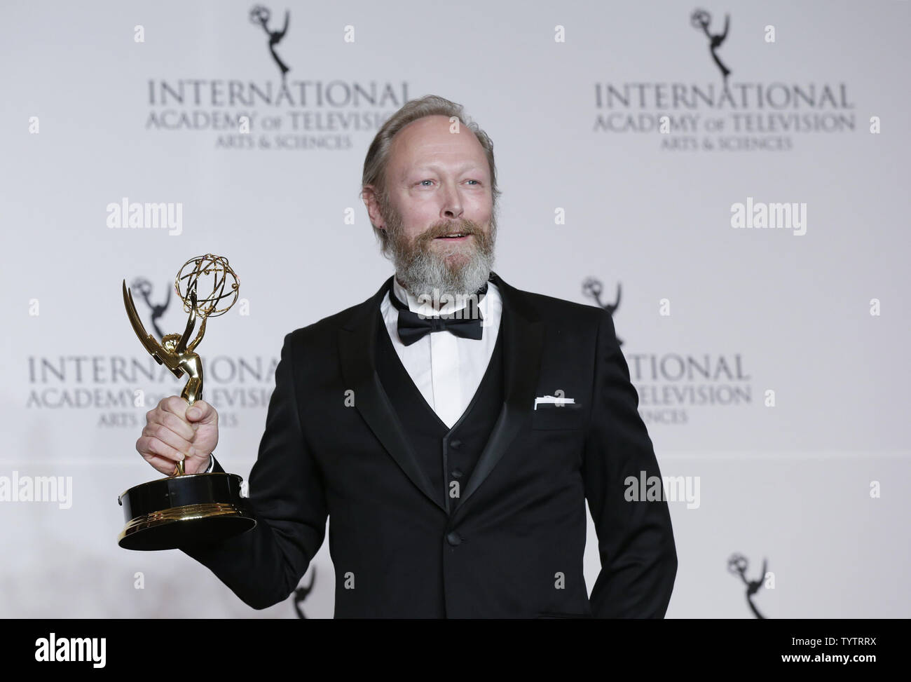 Lars Mikkelsen holds his award for Best Performance by an Actor in the ...