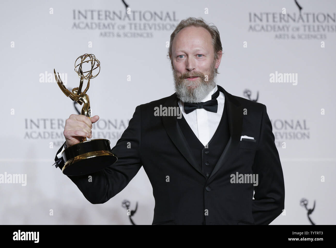Lars Mikkelsen holds his award for Best Performance by an Actor in the ...