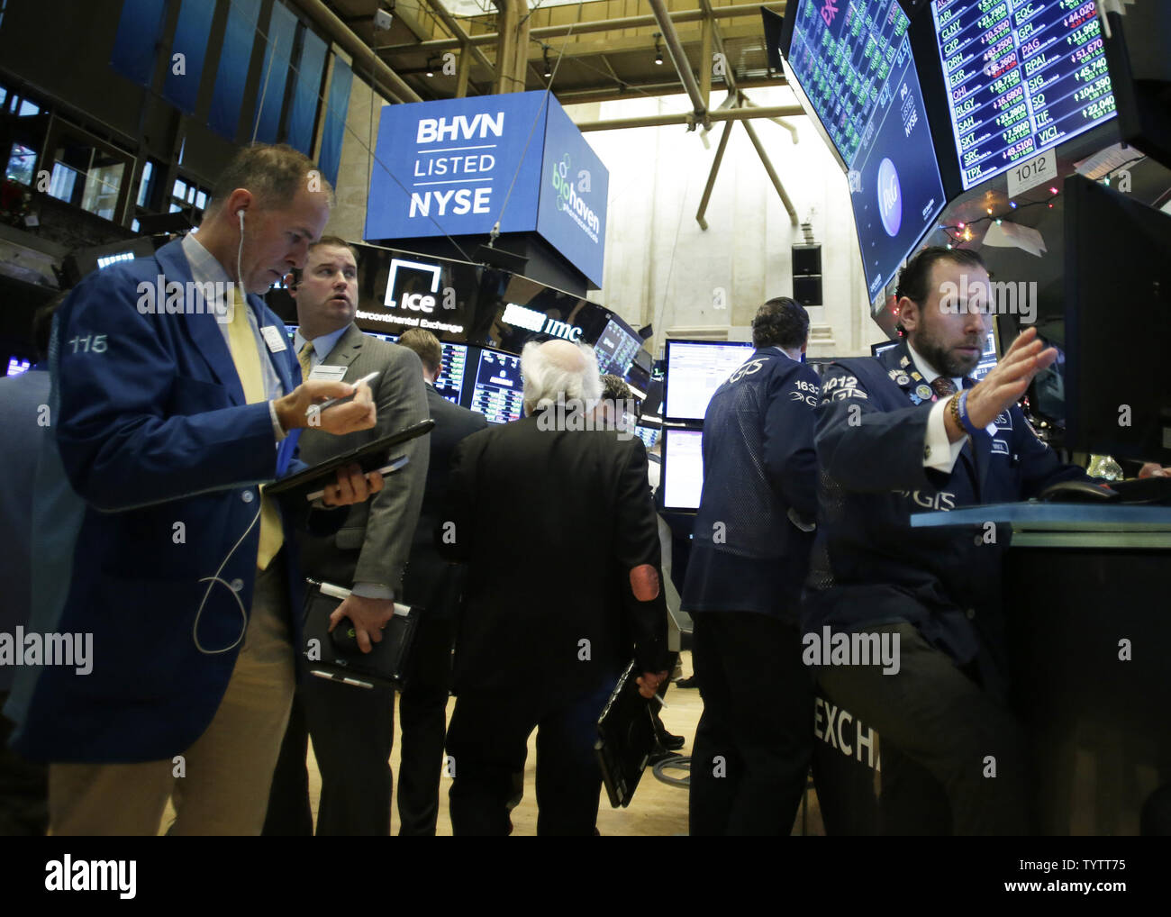 Traders work on the floor of the NYSE at the opening bell at the New ...