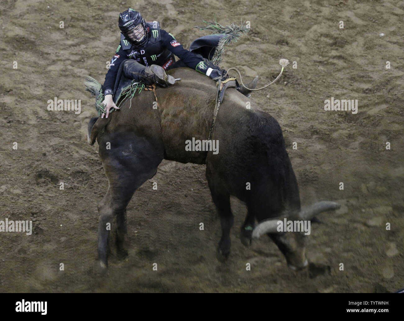 Bull riders compete in the championship round at the Professional Bull ...