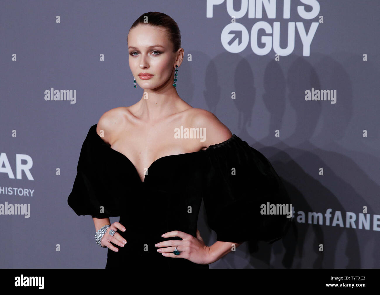Kristina Romanova arrives on the red carpet at the amfAR New York Gala ...