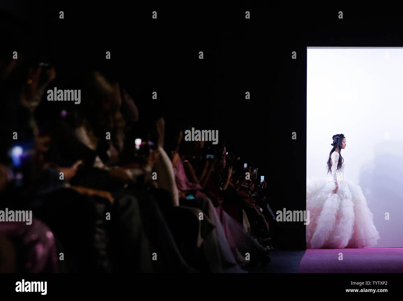 Model Varsha Thapa walks on the runway for the Lanyu fashion show ...
