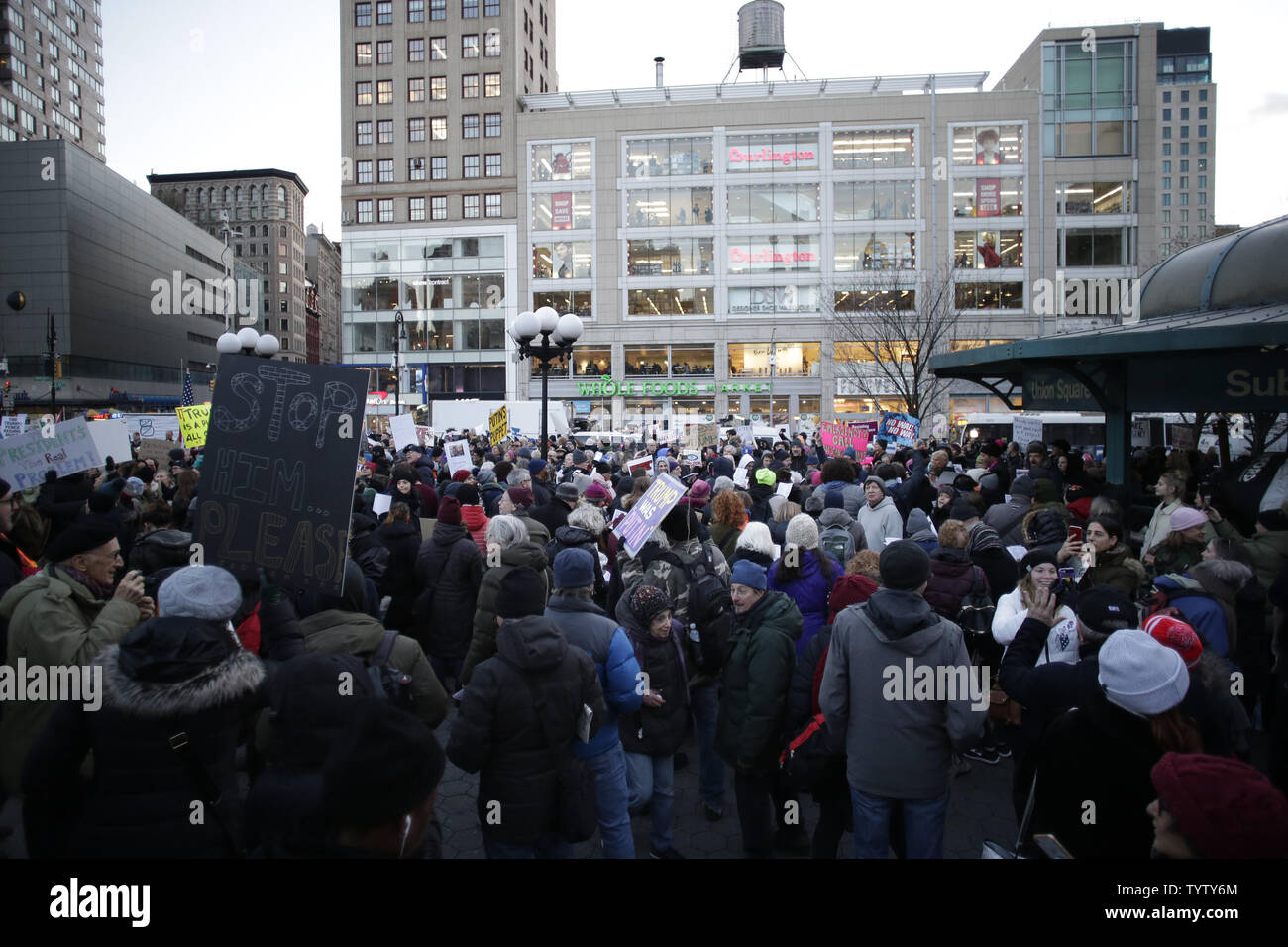 Protesters hold up signs when they gather in Union Square for the "No ...