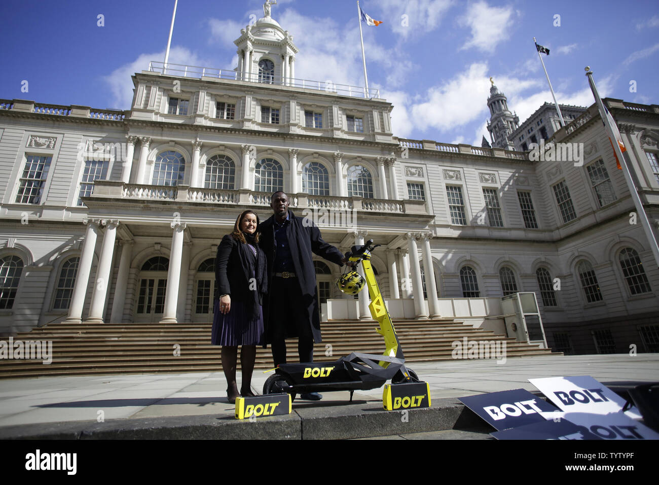 Bolt Mobility scooter co-founder Sarah Haynes stands next to Olympic ...
