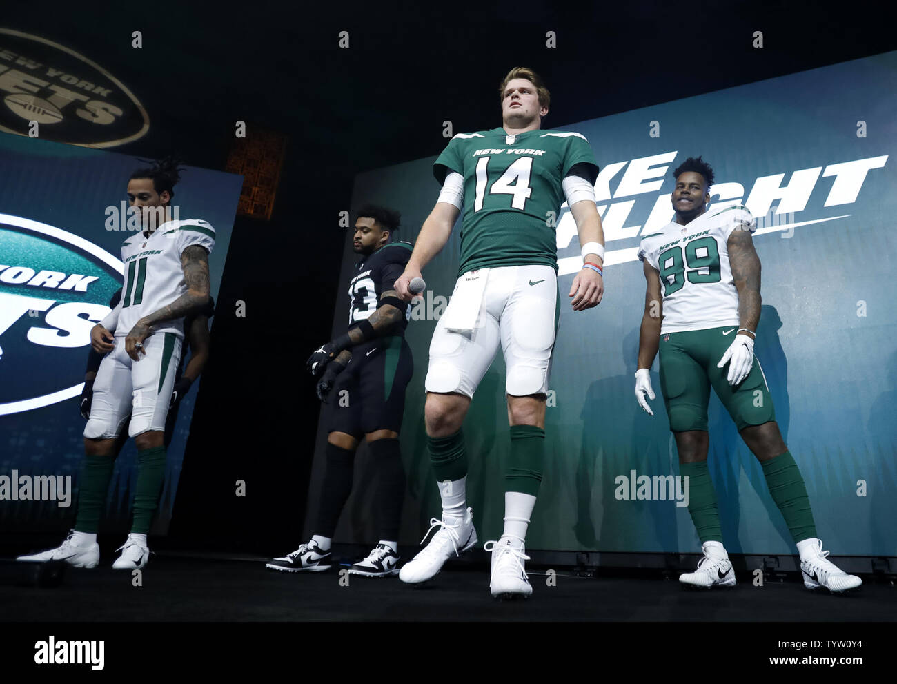 New York Jets quarterback Sam Darnold (14) models the new Jets NFL ...