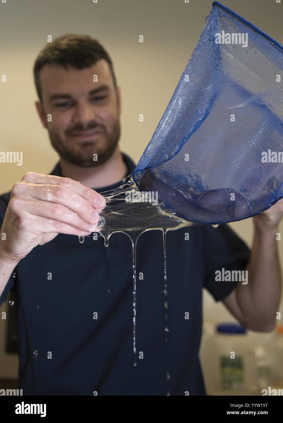 Dr. Ryan Kincer demonstrates the elasticity of the hagfish slime ...