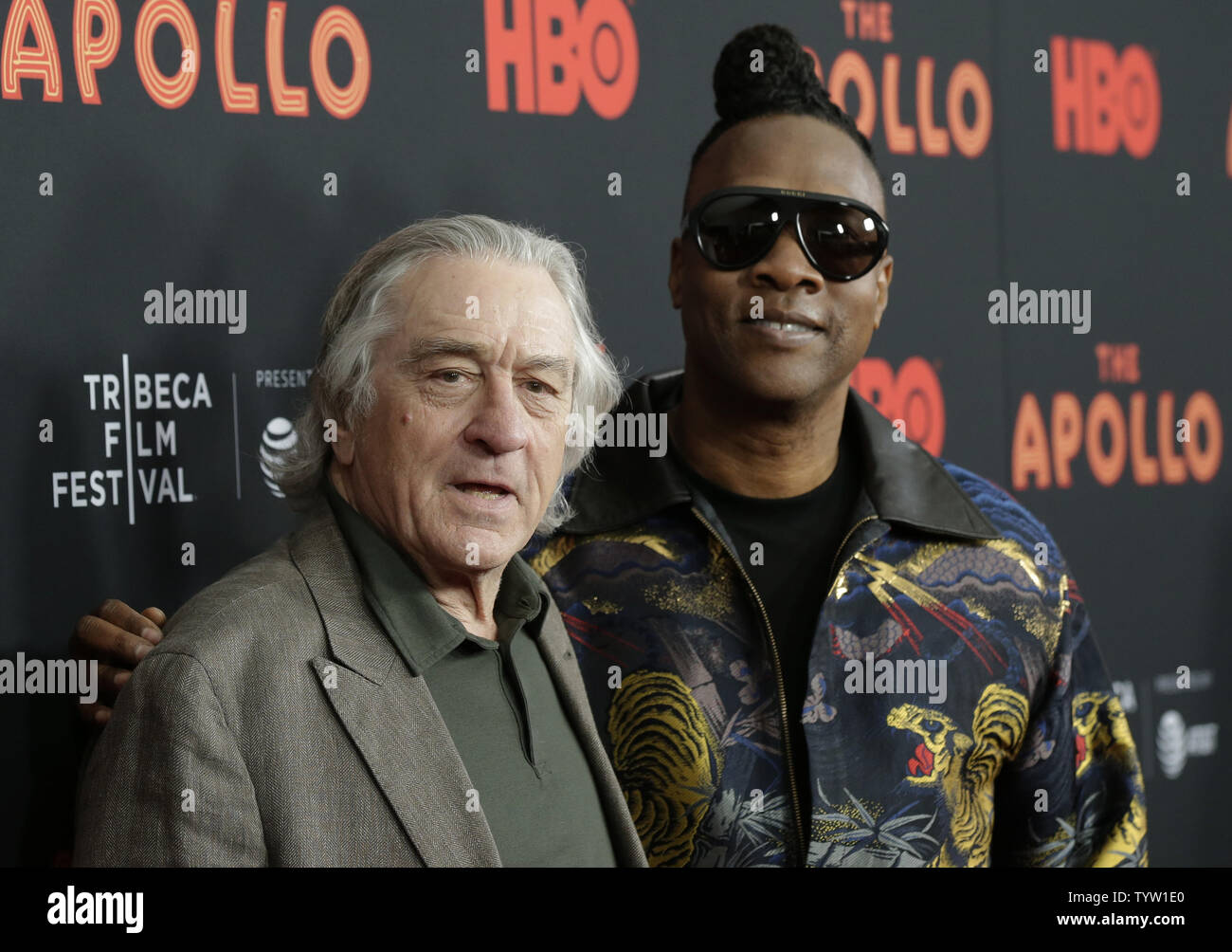 Roger Ross Williams and Robert De Niro arrive on the red carpet for the ...