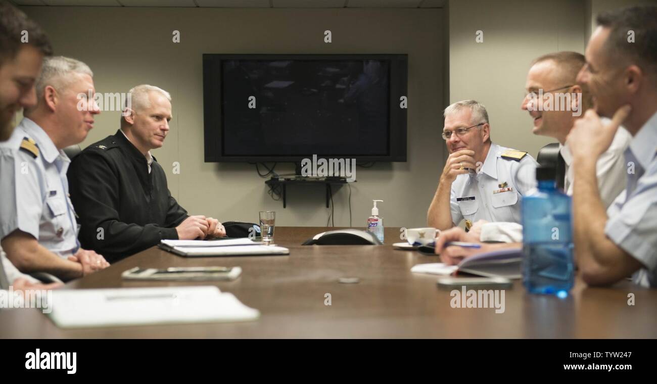 U.S. Coast Guard Rear Admiral Steven Poulin and his staff meet with the ...
