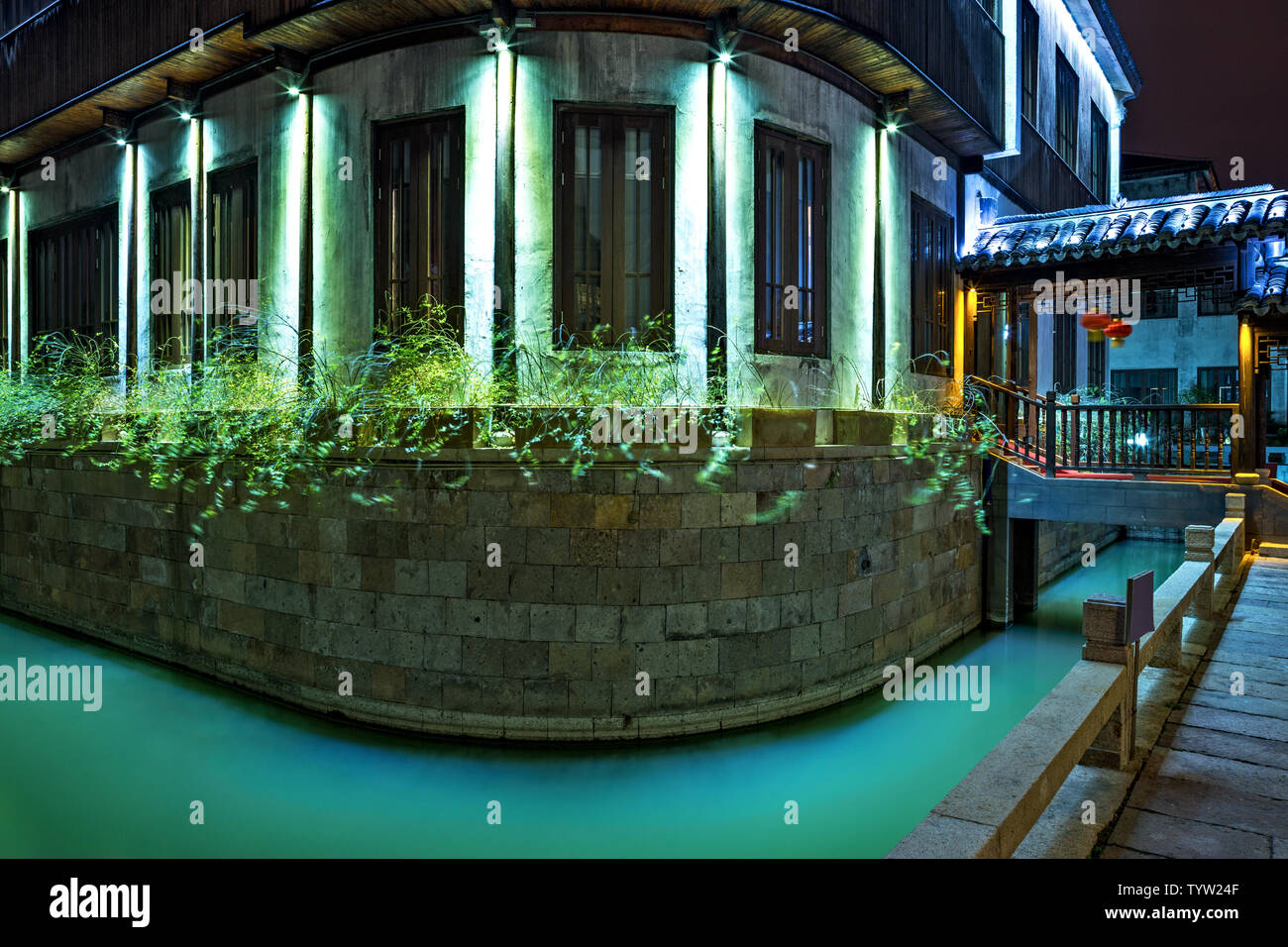 Night scene of traditional building near the river Stock Photo - Alamy