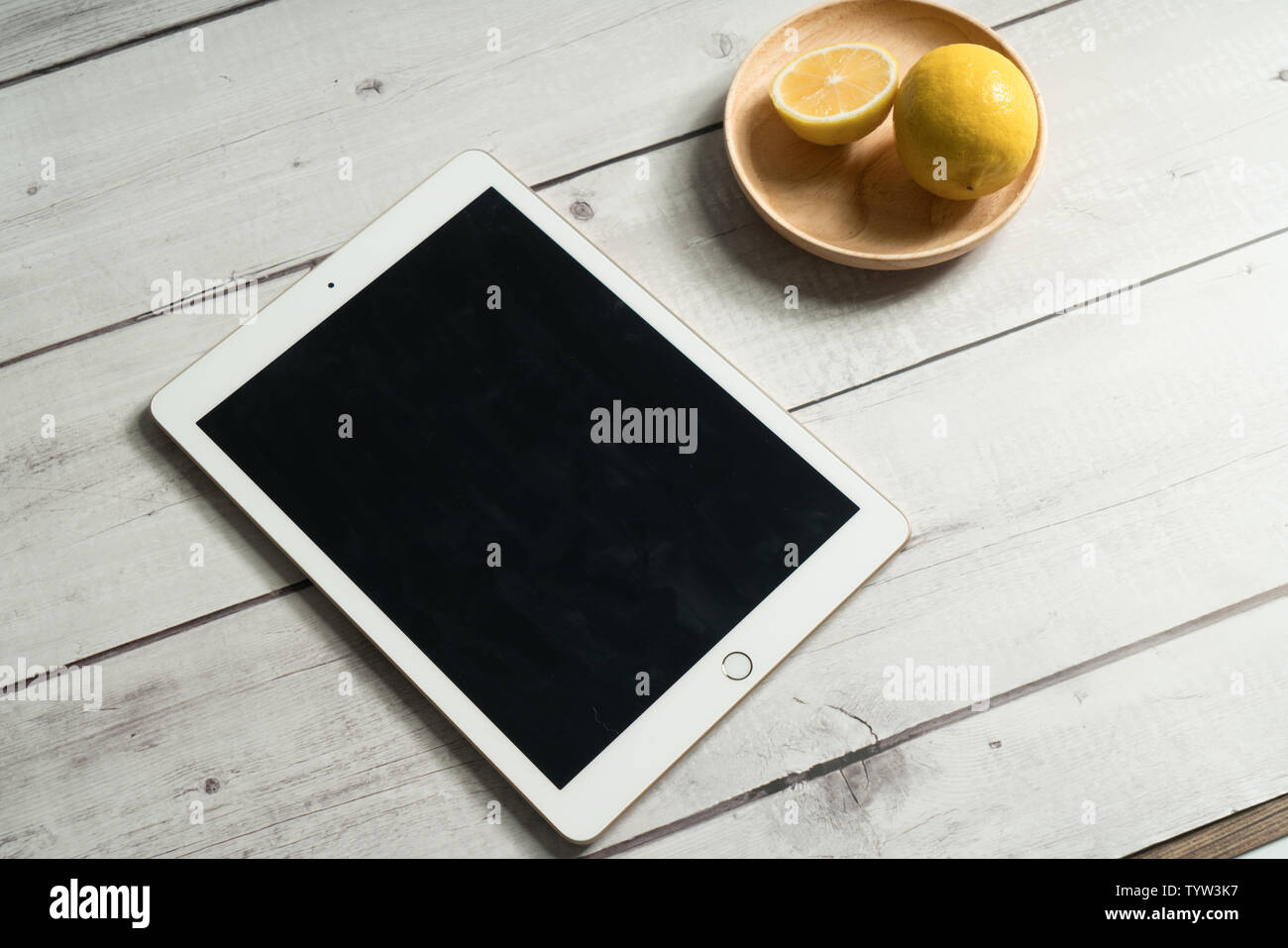 Lemon with tablet Stock Photo - Alamy
