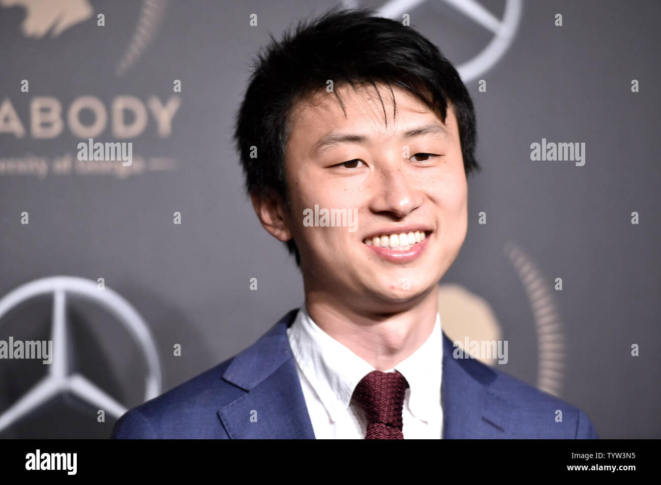 Bing Liu arrives in the press room with an award at the 78th Annual ...