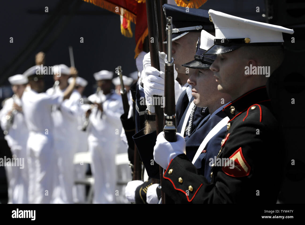The US Military color guard stands at attention during the playing of ...