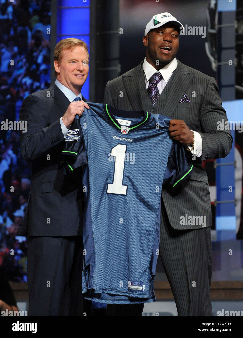 Russell Okung, tackle from Oklahoma State, stands with NFL Commissioner ...