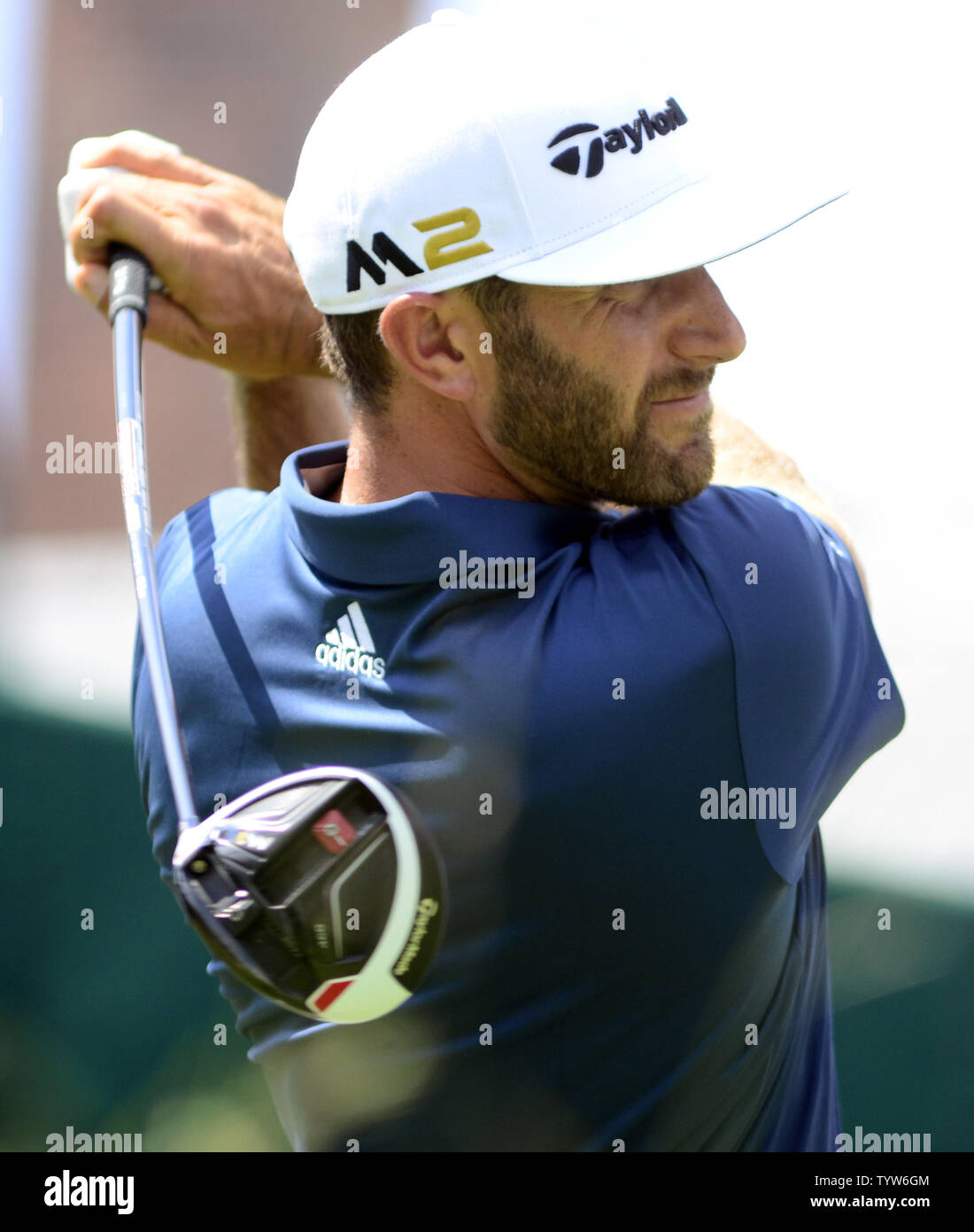 Dustin Johnson drives his tee shot on the first hole of the final round ...