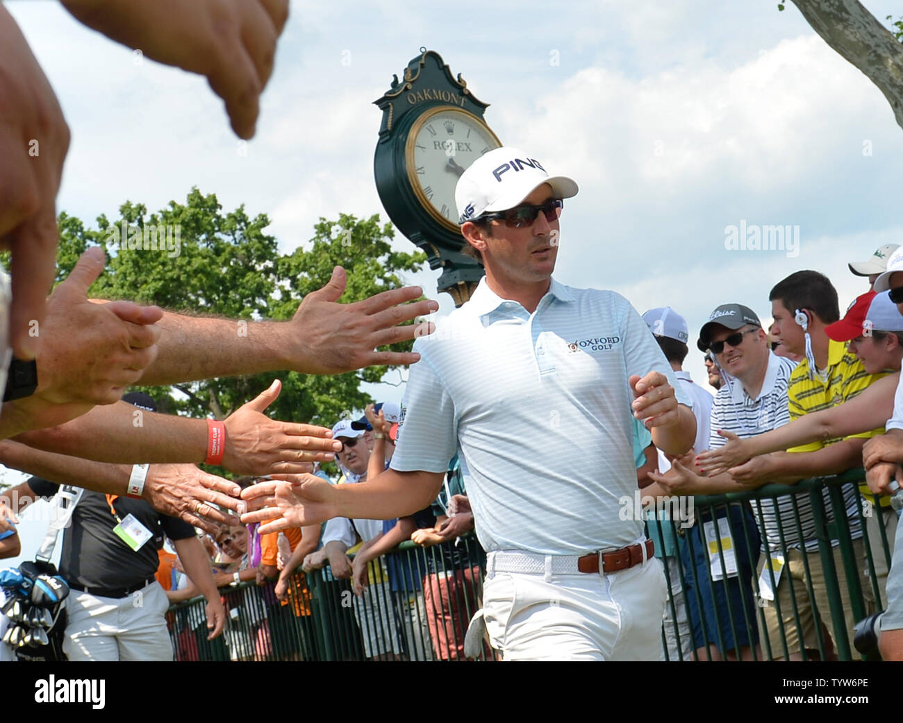 Patrons greet Andrew Landry as he walks to the First tee box in the ...