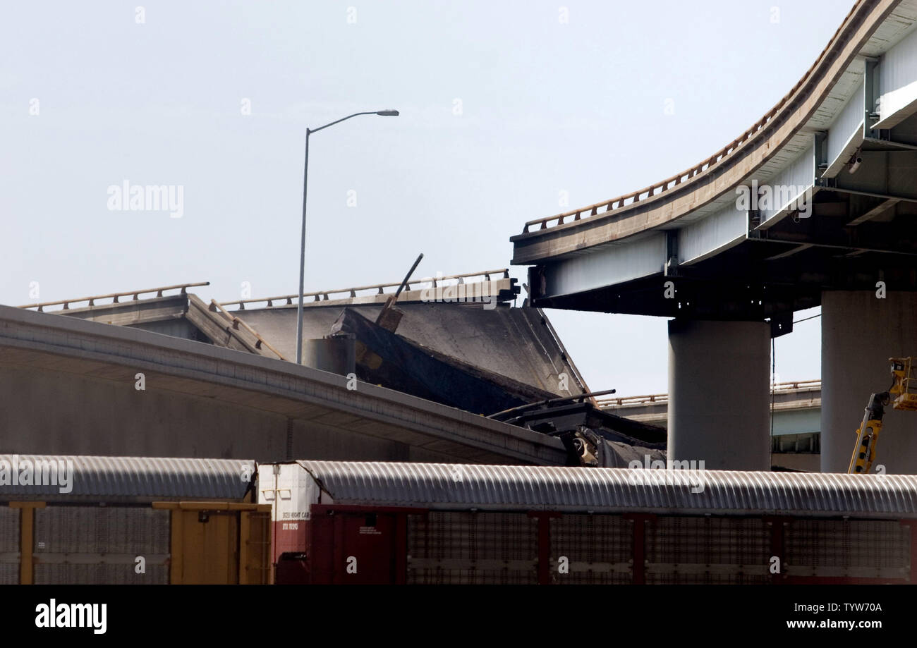 A section of highway lies collapsed near the San Francisco-Oakland Bay ...