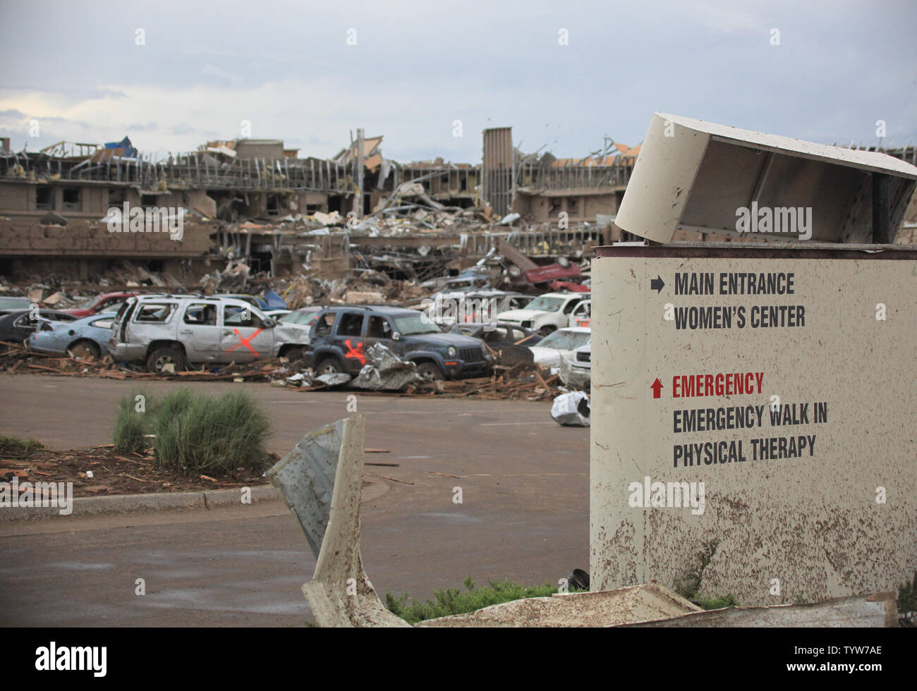 A path of destruction is seen in the aftermath of a series of tornadoes ...