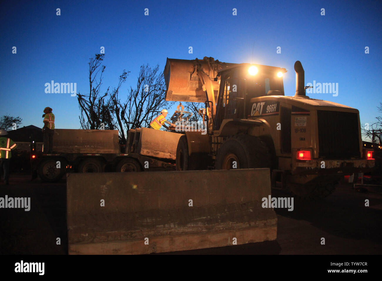 Rescue workers search through debris in Moore, Oklahoma on May 22, 2013 ...