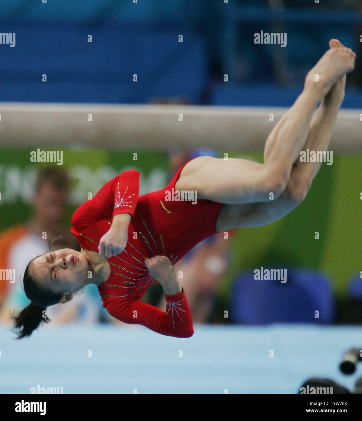 Chinese gymnast CHENG Fei pulls around a double-twisting double back ...