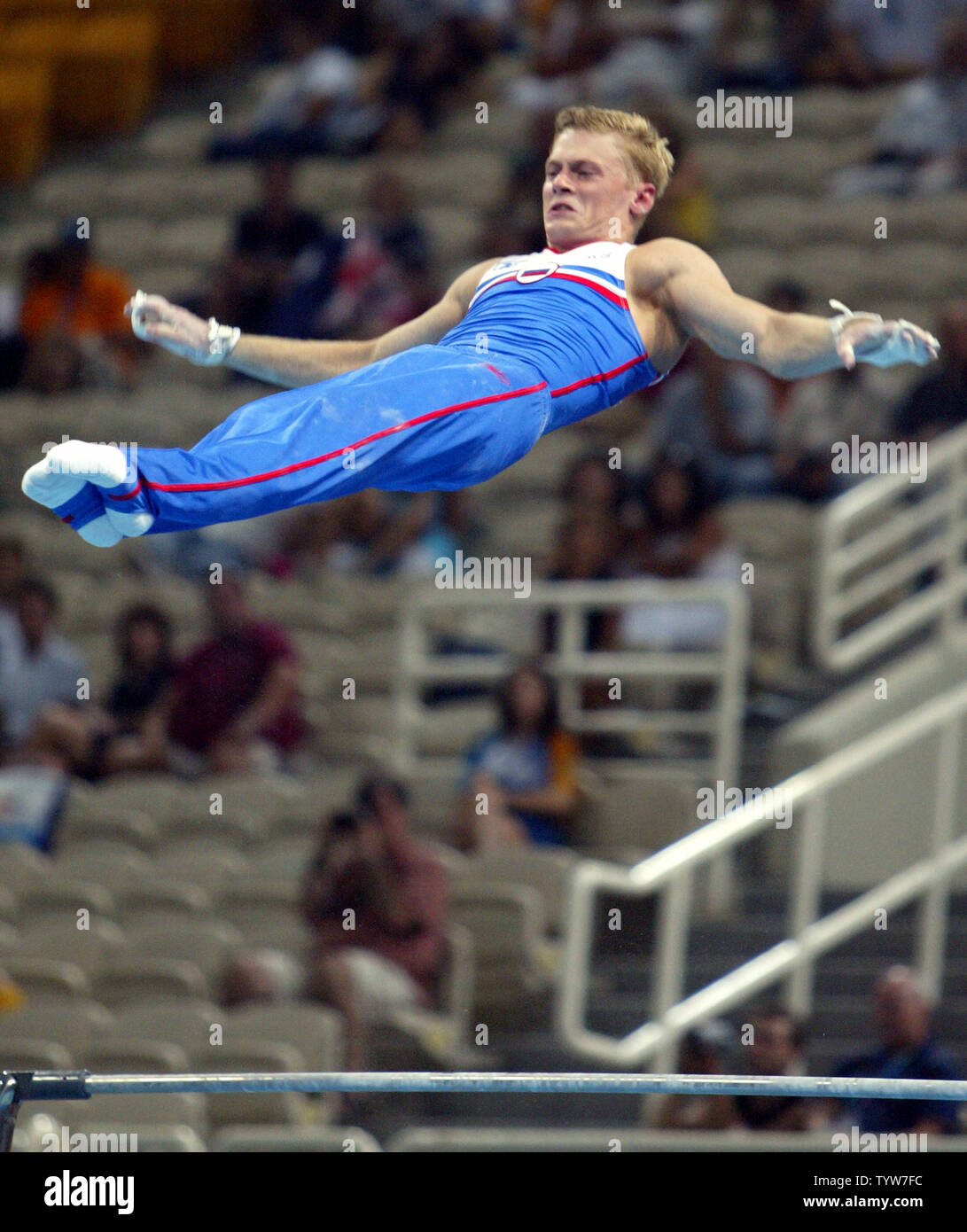 Russian gymnast Alexei Bondarenko flies through his high bar routine ...