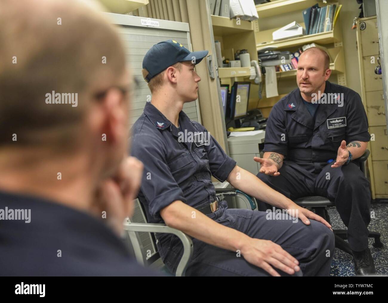 OCEAN (Nov. 29, 2016) Master Chief Petty Officer Jan Rega, left, command master chief of the USS ...