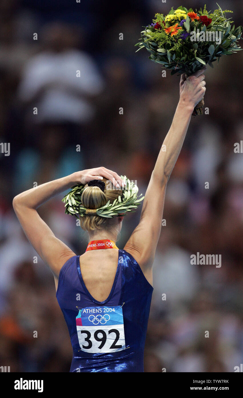 Russian gymnast Svetlana Khorkina secures her laurel after winning the ...