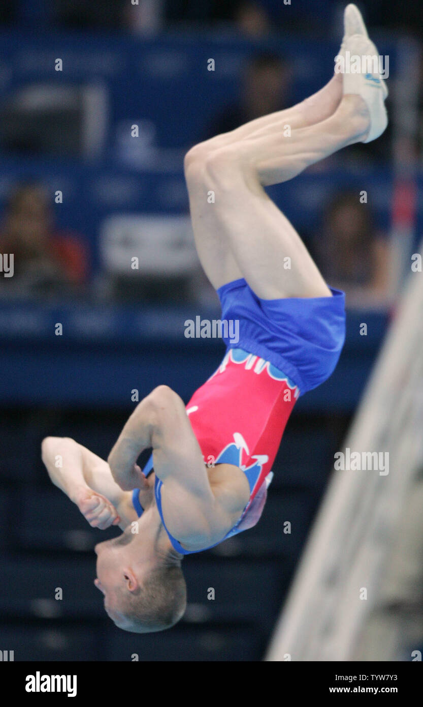 Kyle Shewfelt of Canada performs a double-twisting double back ...