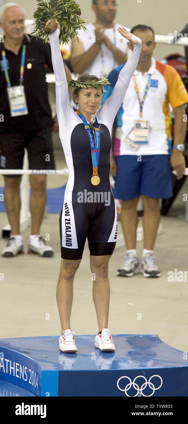 Sarah Ulmer of New Zealand waves from the podium with her gold medal ...