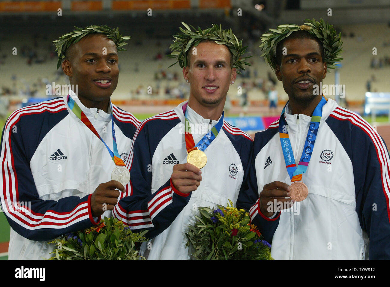 On the podium L. to R. Otis Harris (silver), Jeremy Wariner (gold) and ...